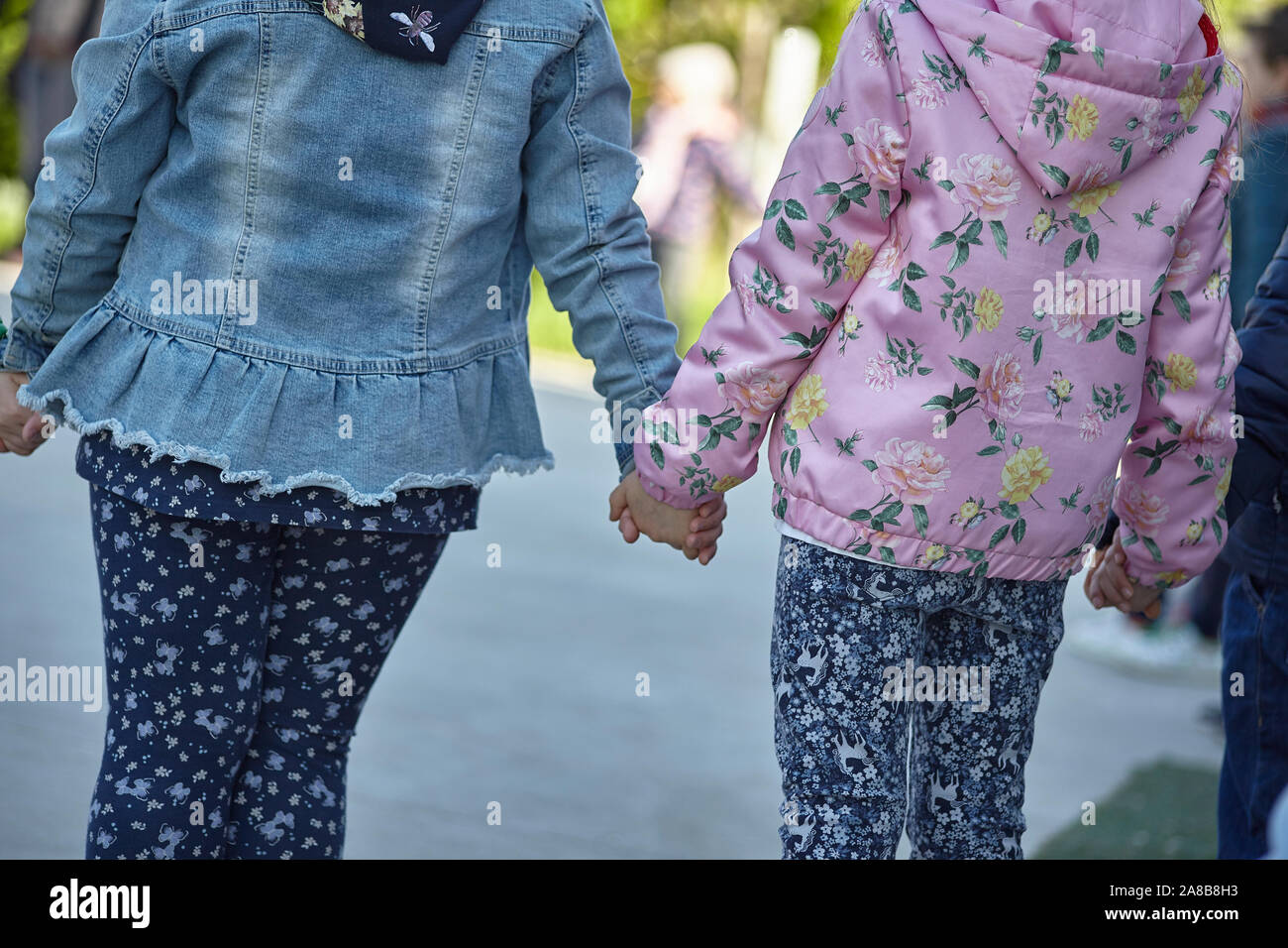 Hand by hand Stock Photo - Alamy