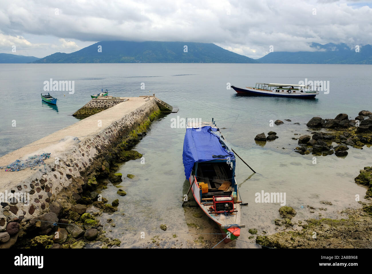 Indonesia Alor - jetty with local transport boats Stock Photo - Alamy