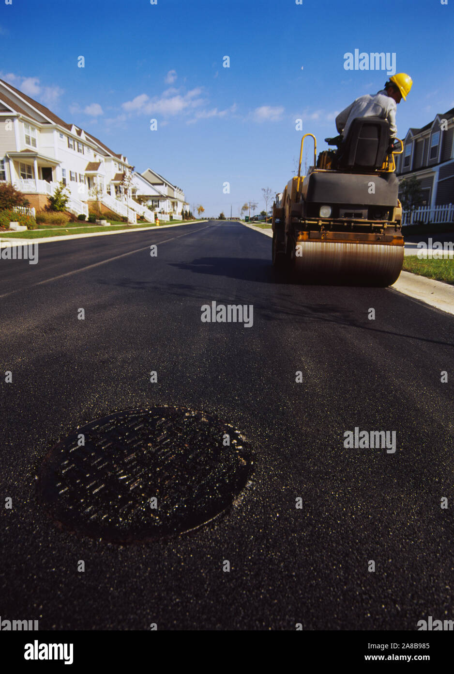 Rear view of a man sitting on a steamroller, Lititz, Pennsylvania, USA ...
