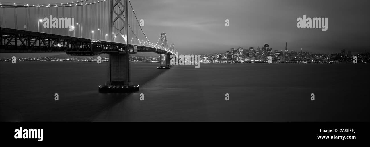 Low angle view of a suspension bridge lit up at night, Bay Bridge, San ...