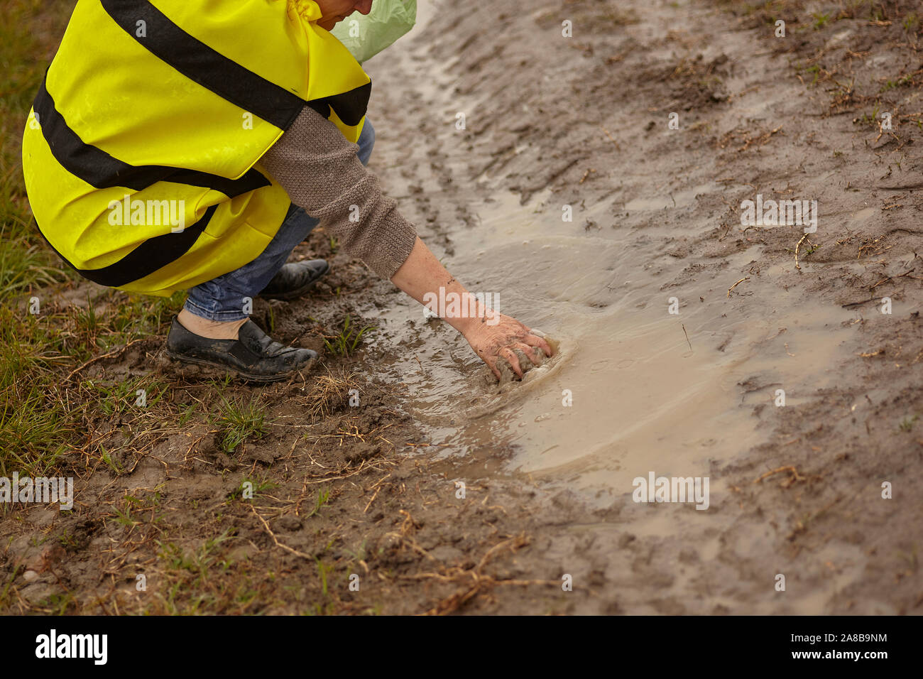 Hand inside a puddle Stock Photo - Alamy