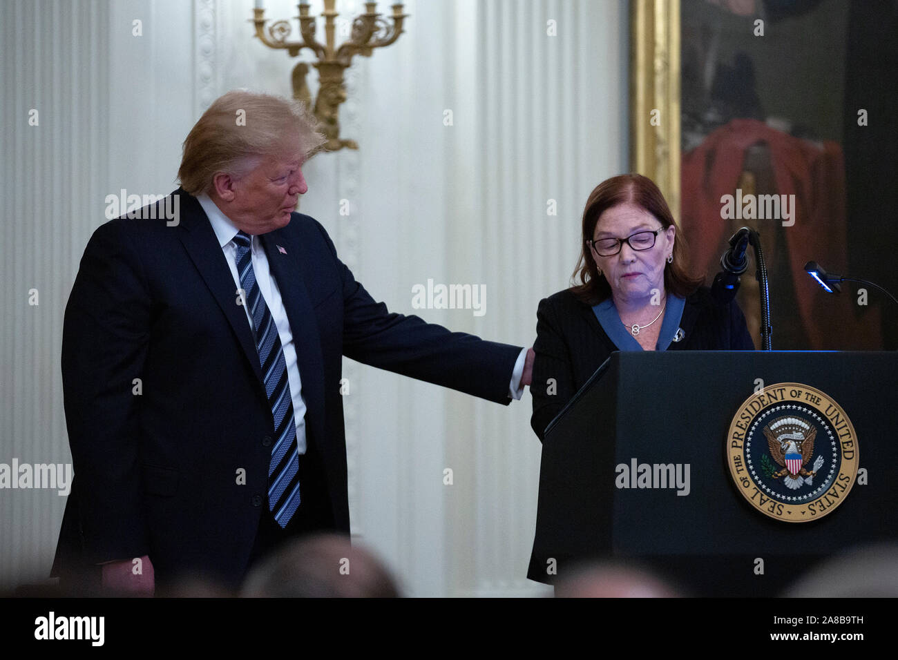 Susan Rescorla, the widow of Richard Rescorla, accepts the Presidential ...