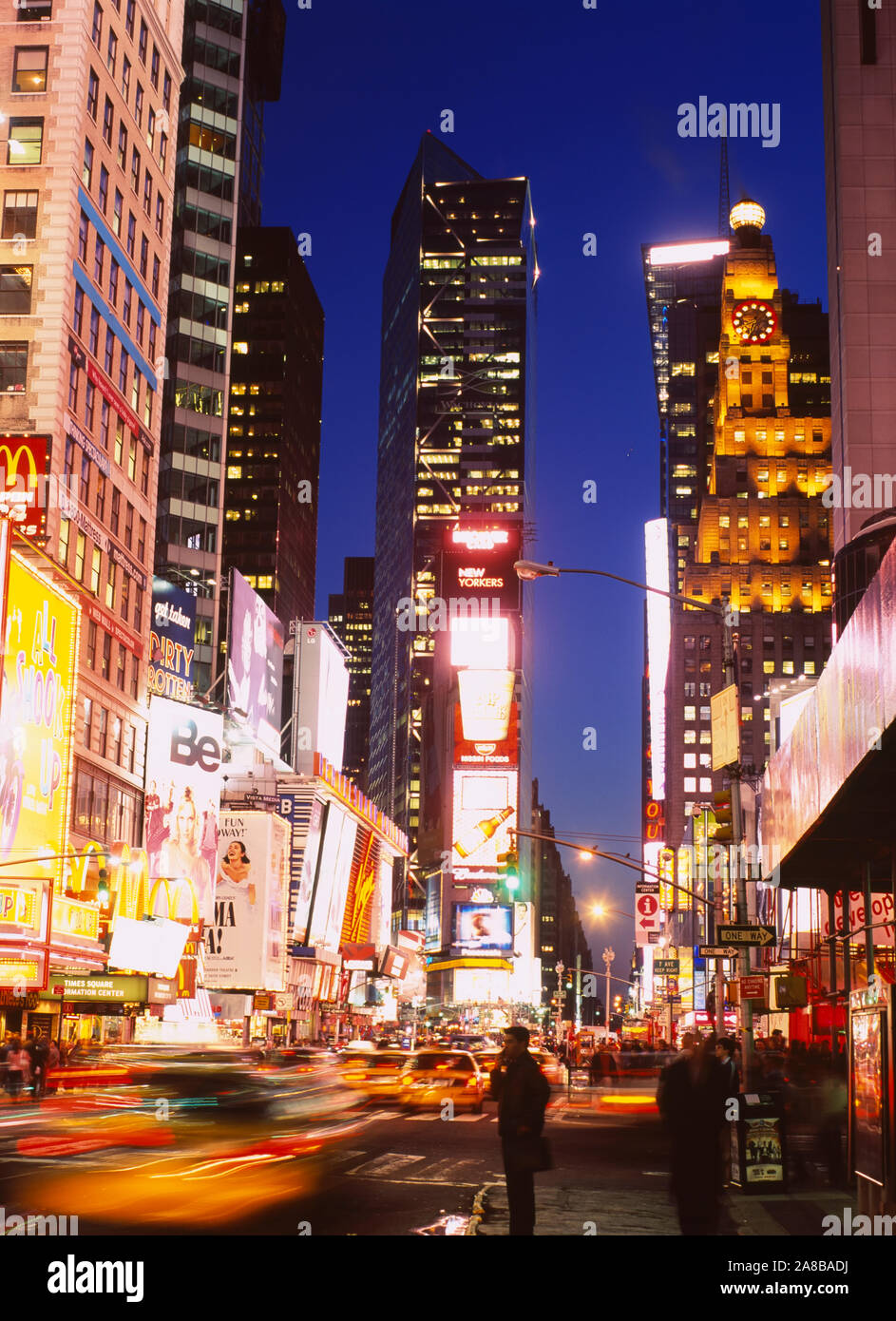 Buildings in a city lit up at dusk, Times Square, Manhattan, New York ...