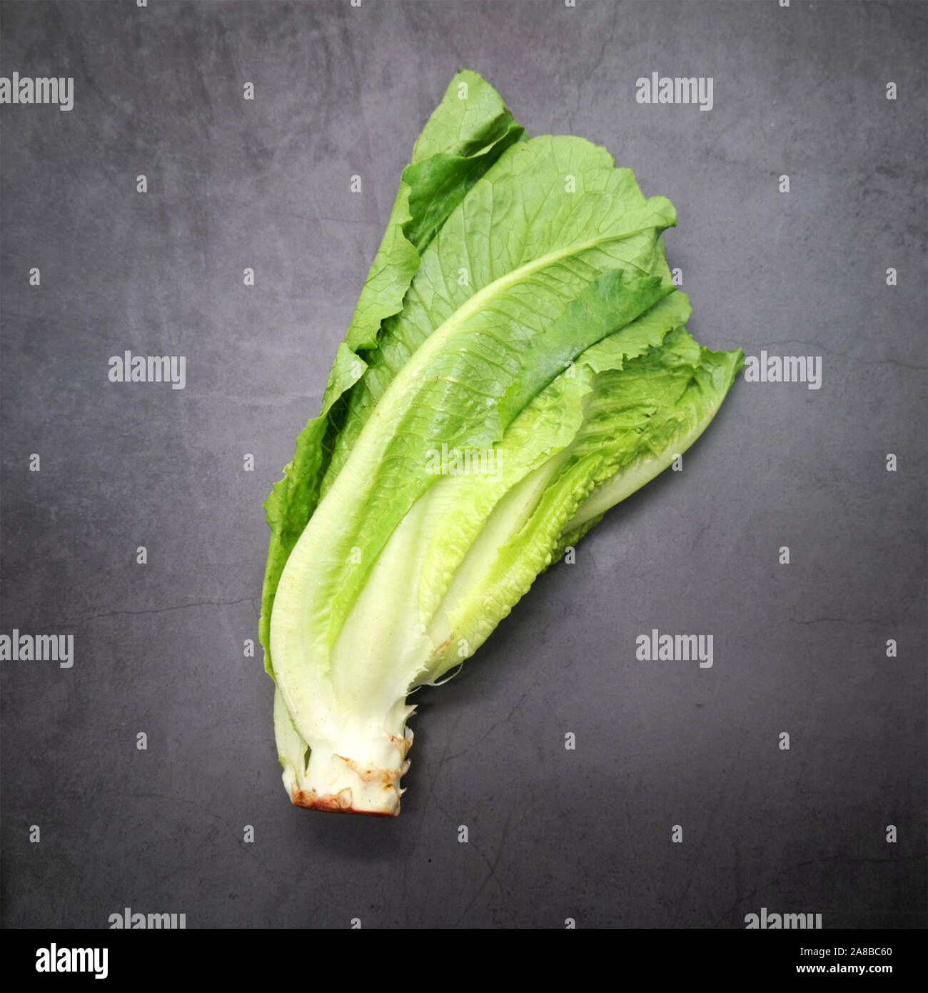 Heart Lettuce Fresh Vegetable On The Grey Background Stock Photo - Alamy