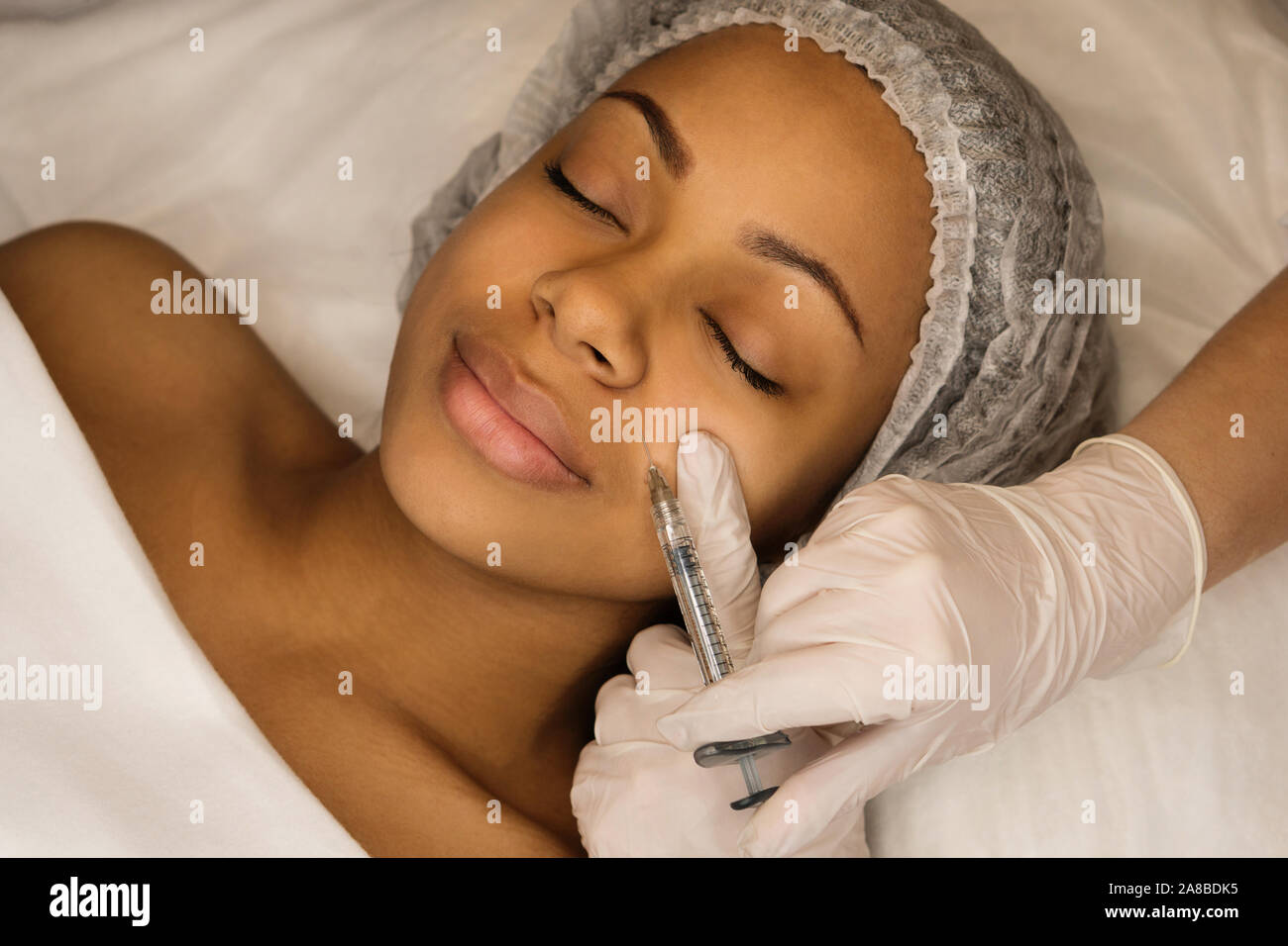 Injection cosmetology: contour plastic. Doctor makes rejuvenating ...