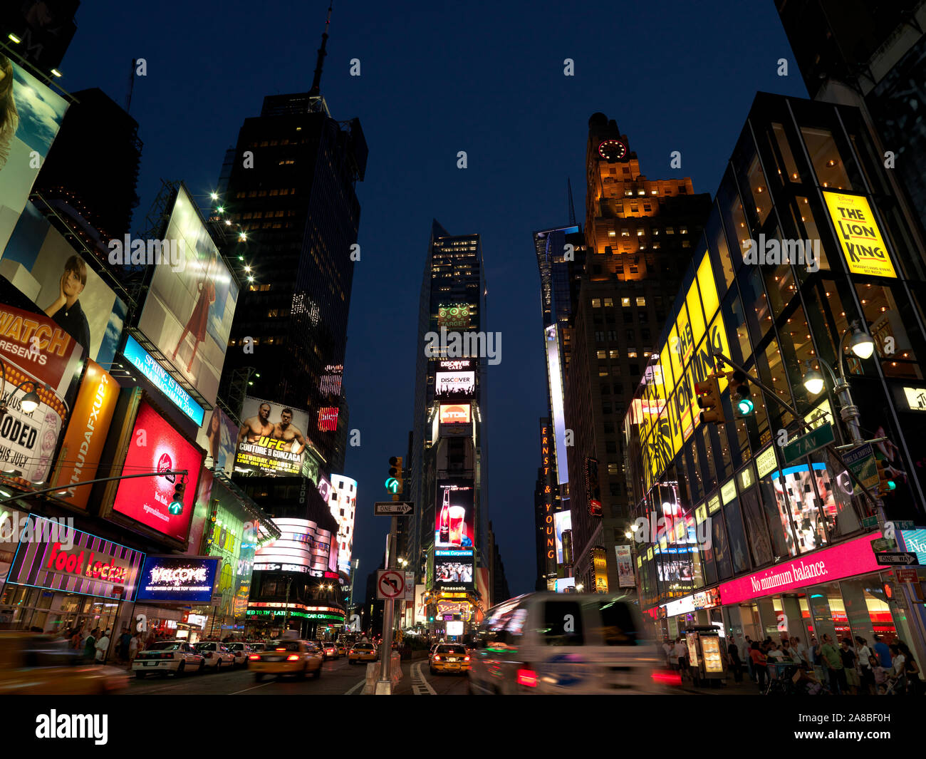 Buildings in a city lit up at dusk, Times Square, Manhattan, New York ...