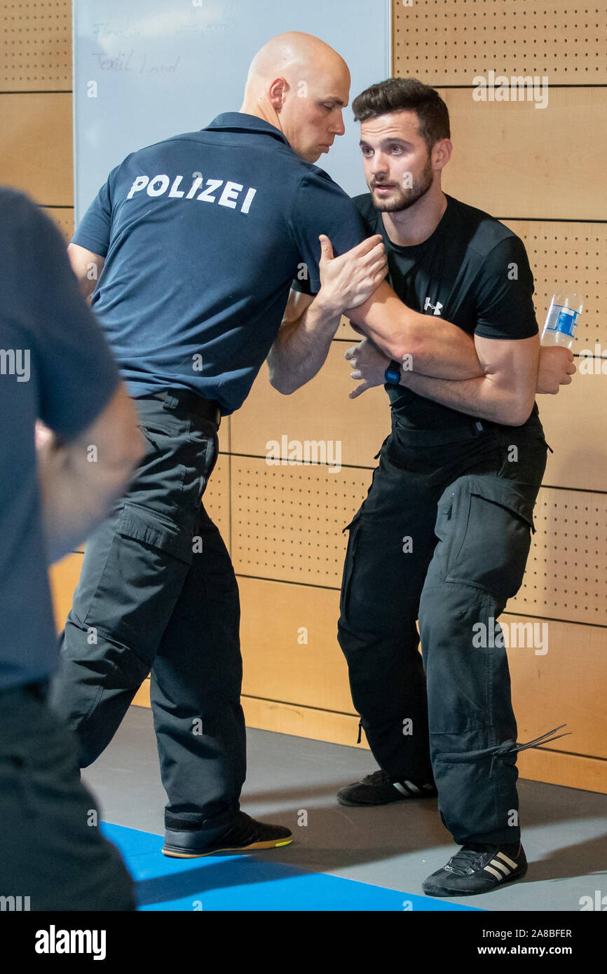 16 October 2019, Bavaria, Würzburg: David Lippert (r), police superintendent and trainer for ...