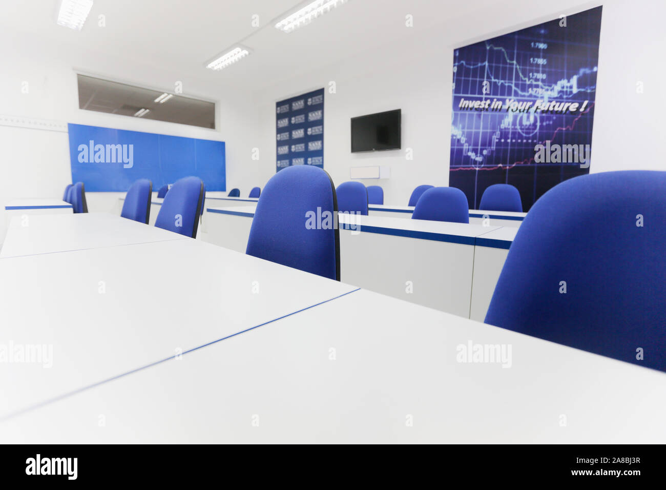 Economy school classroom without students or teachers with chairs and ...