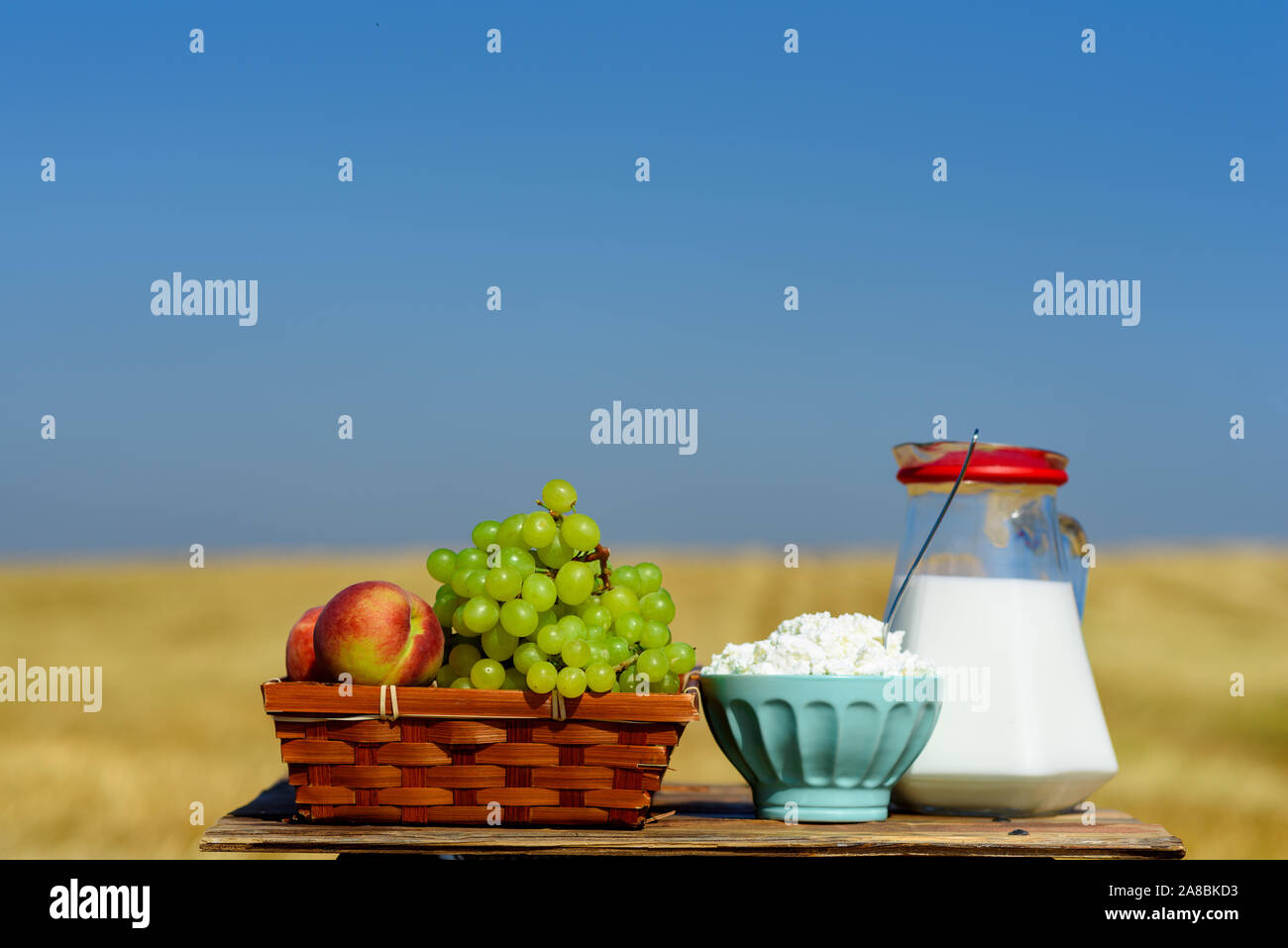 First fruits habikkurim in hebrew, white cheese and milk on wooden ...