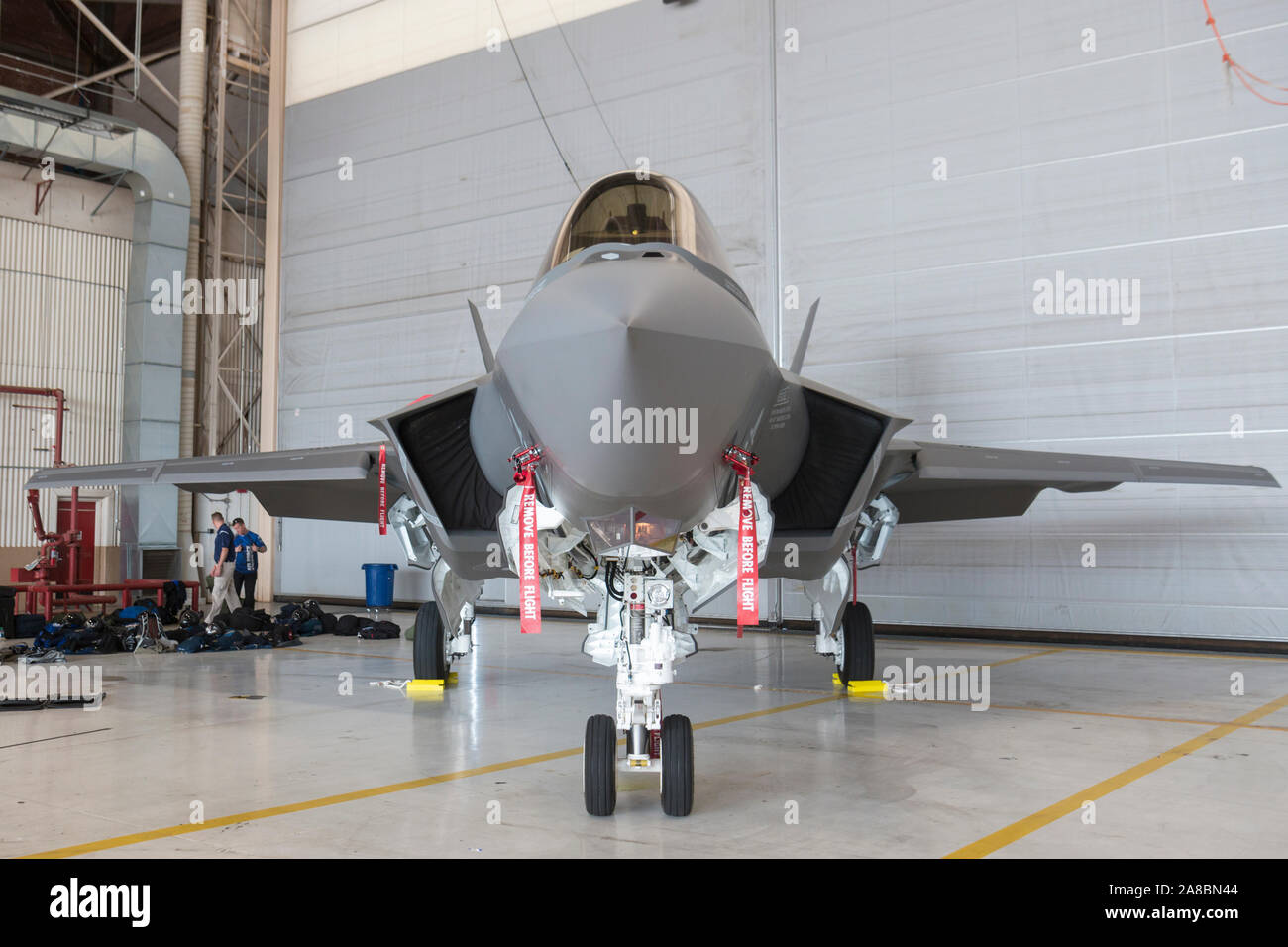 A USMC F-35B Lightning II sits on static display while being guarded at ...