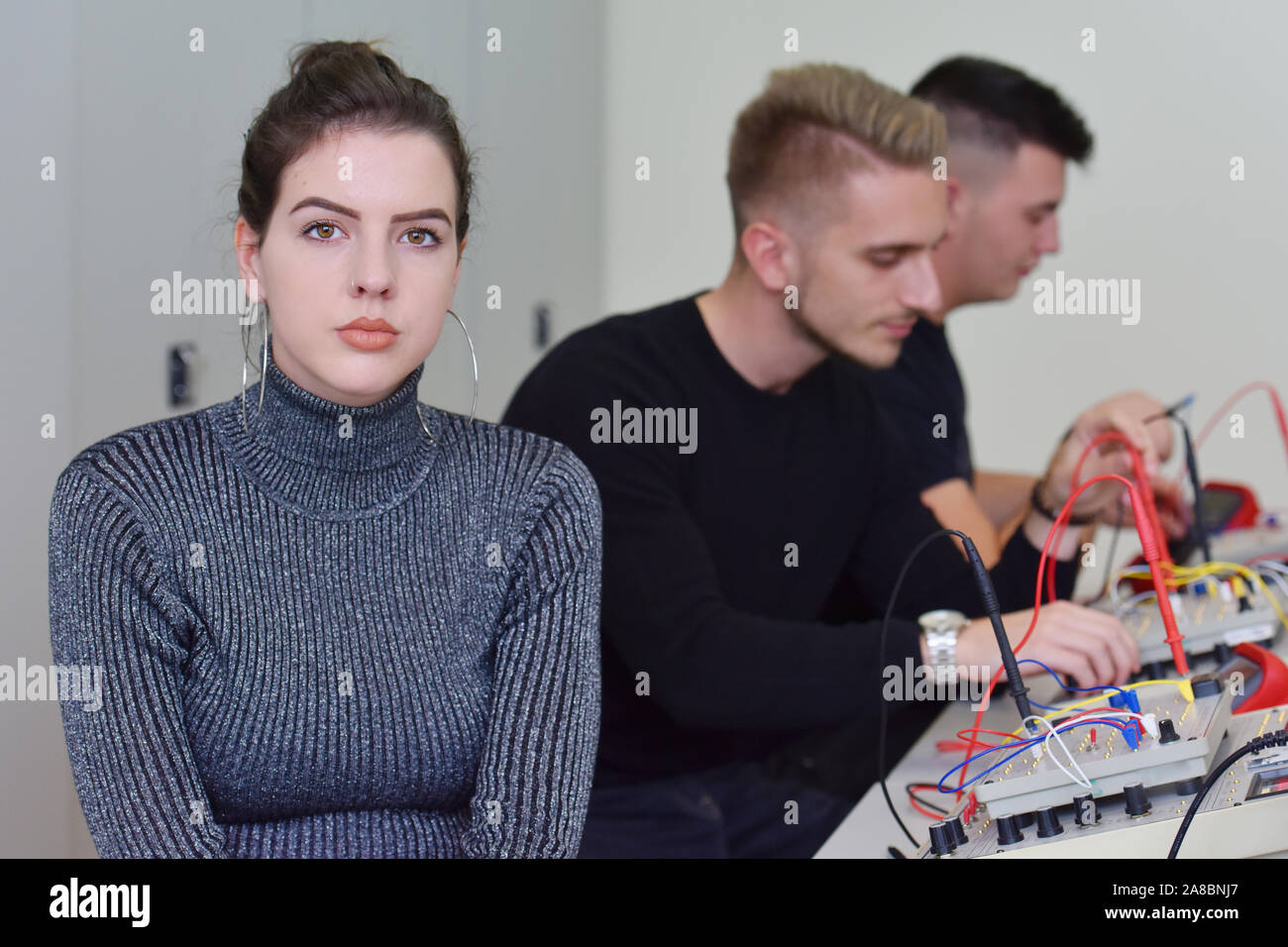 Group of young students in technical vocational training with teacher ...