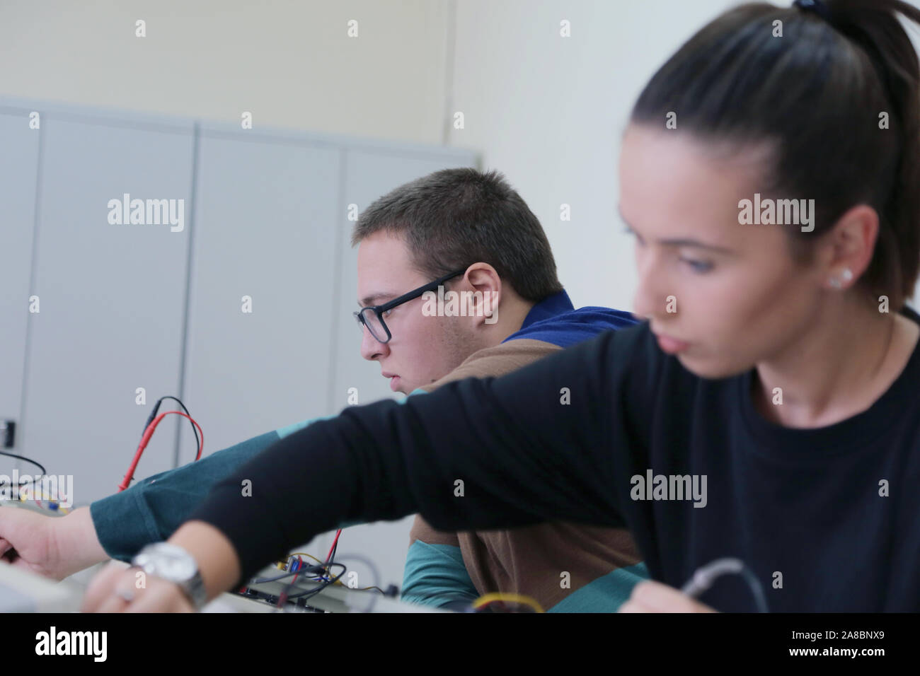 Two young students in technical vocational training, the lesson in ...