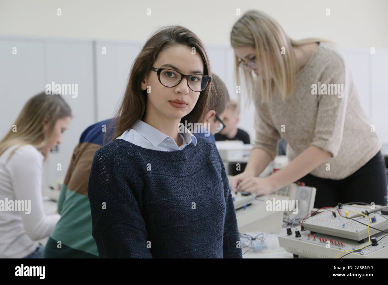 Group of young students in technical vocational training with teacher ...