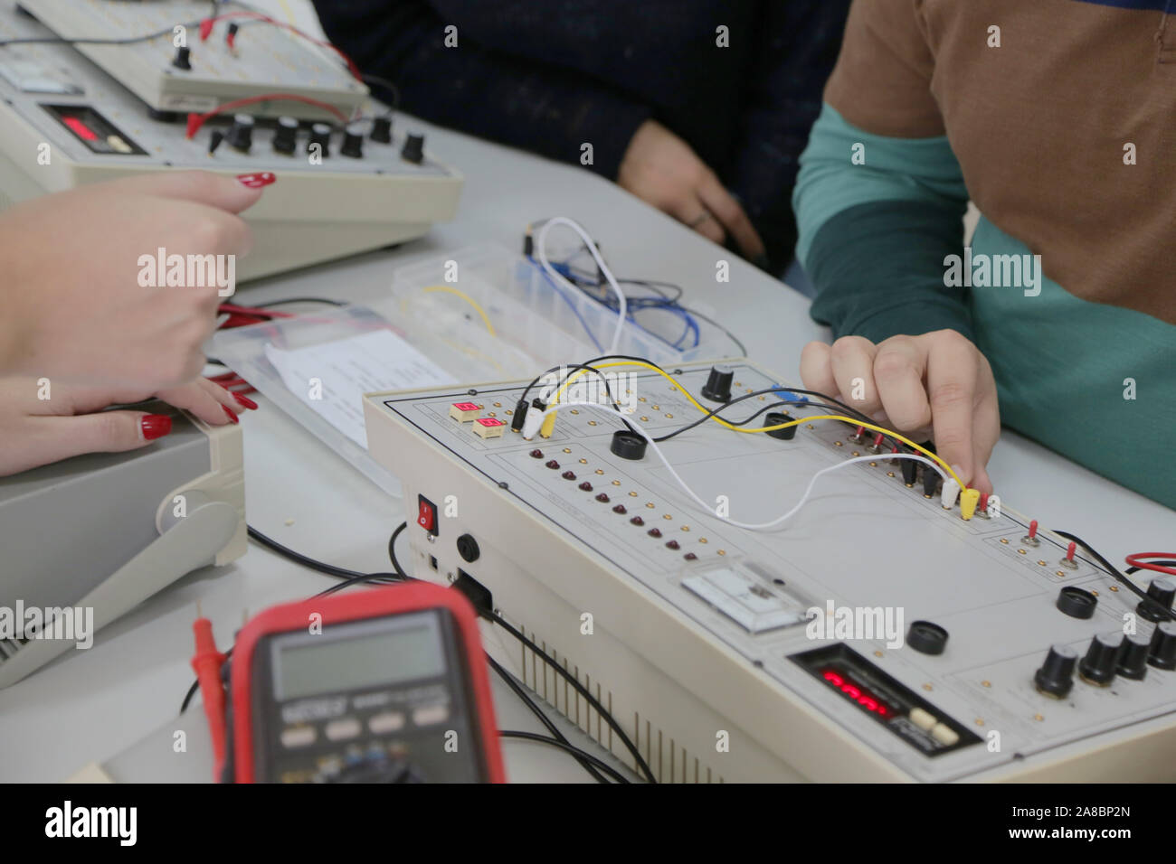 Group of young students in technical vocational training with teacher ...