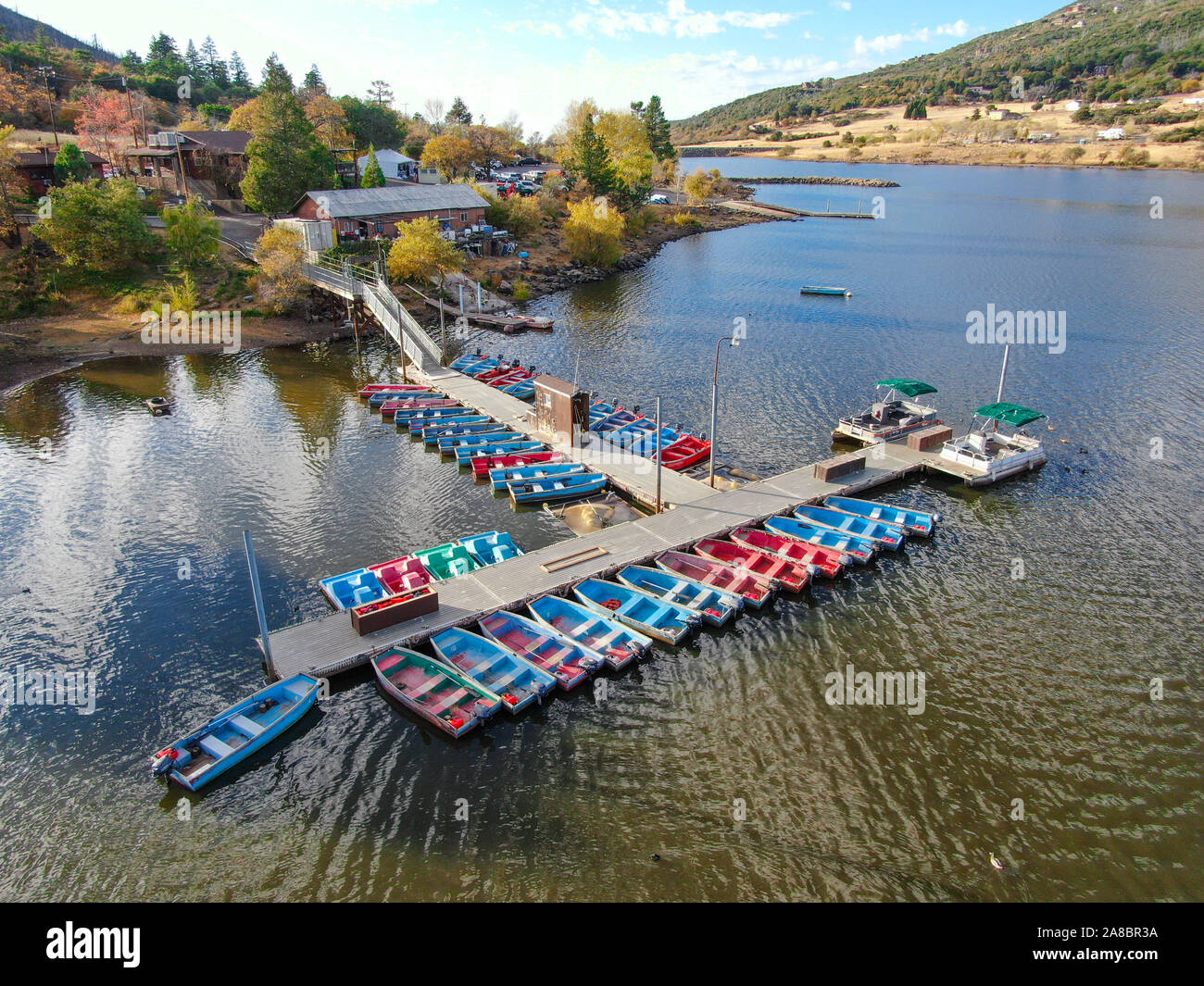 Aerial view of pier with small boat at Lake Cuyamaca, 110 acres ...