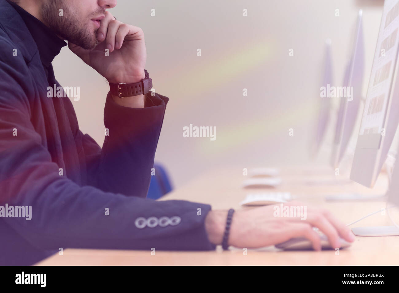 Young male Businessman working on modern computer. Businessman using ...