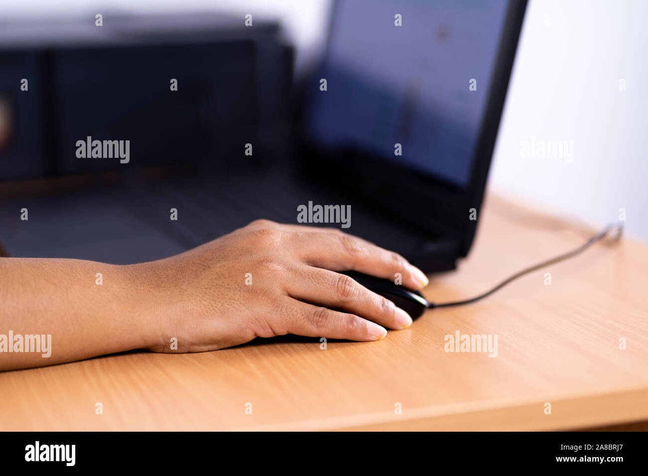 Female hand holding computer mouse Stock Photo - Alamy