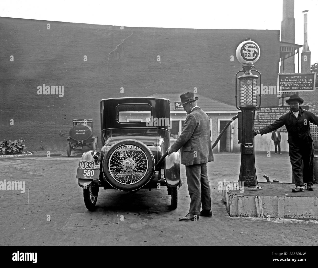 Pumping gas into car Black and White Stock Photos & Images - Alamy