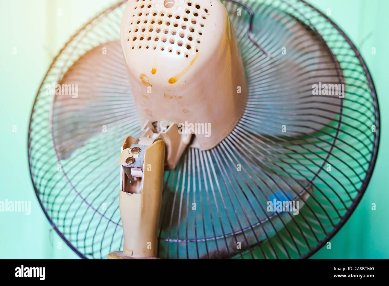 Close up to the old plastic joints of the electronic fan damaged and ...