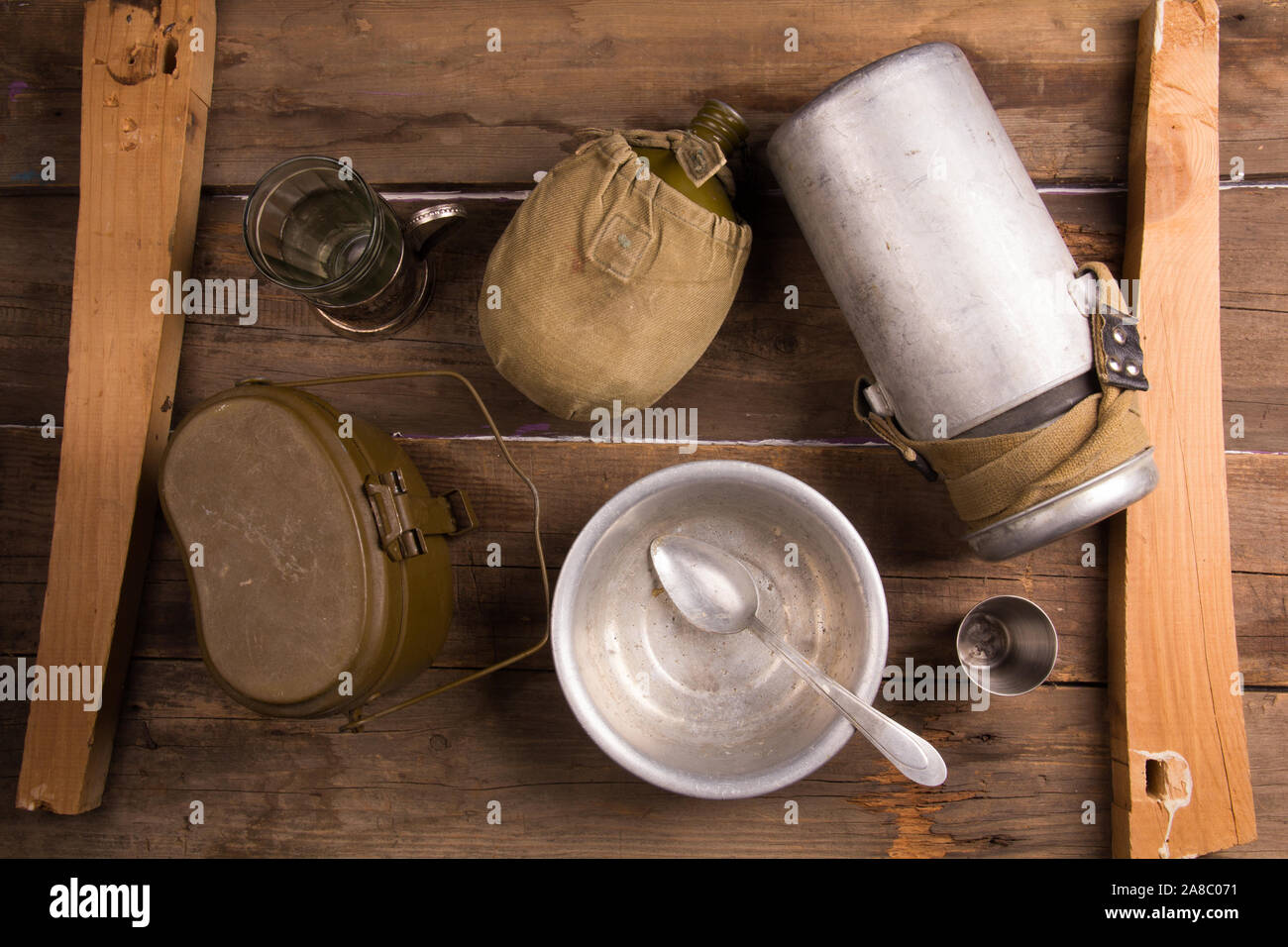 Old army crockery on a wooden background Stock Photo - Alamy