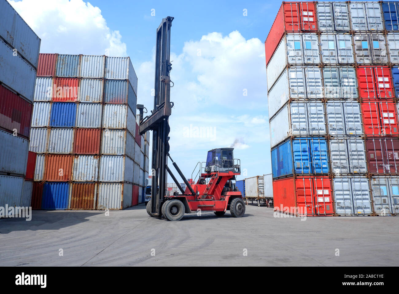 Mobile cranes and containers In the cargo storage yard Stock Photo - Alamy