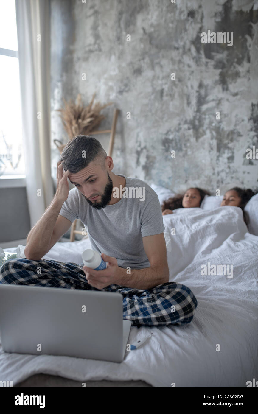 Father feeling confused not knowing what to do with sick children Stock ...