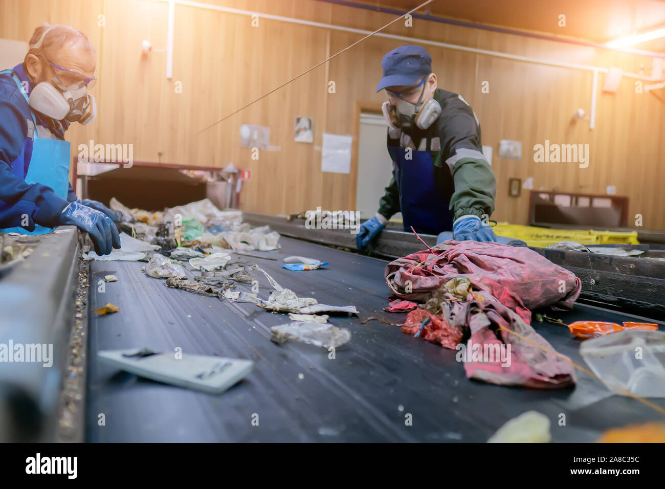 Conveyor for sorting garbage waste by people. Garbage processing Stock ...