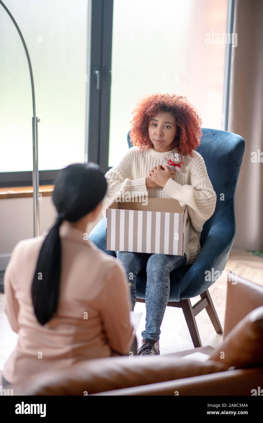 Young woman coming to psychoanalyst after child loss Stock Photo - Alamy