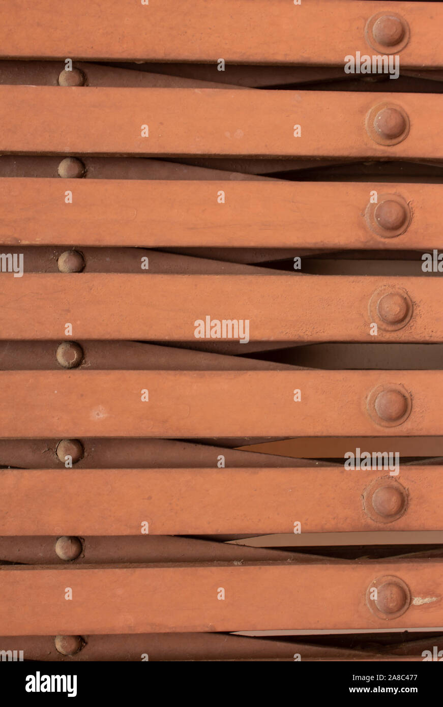 Close look at the collapsible gate and the rivets Stock Photo - Alamy