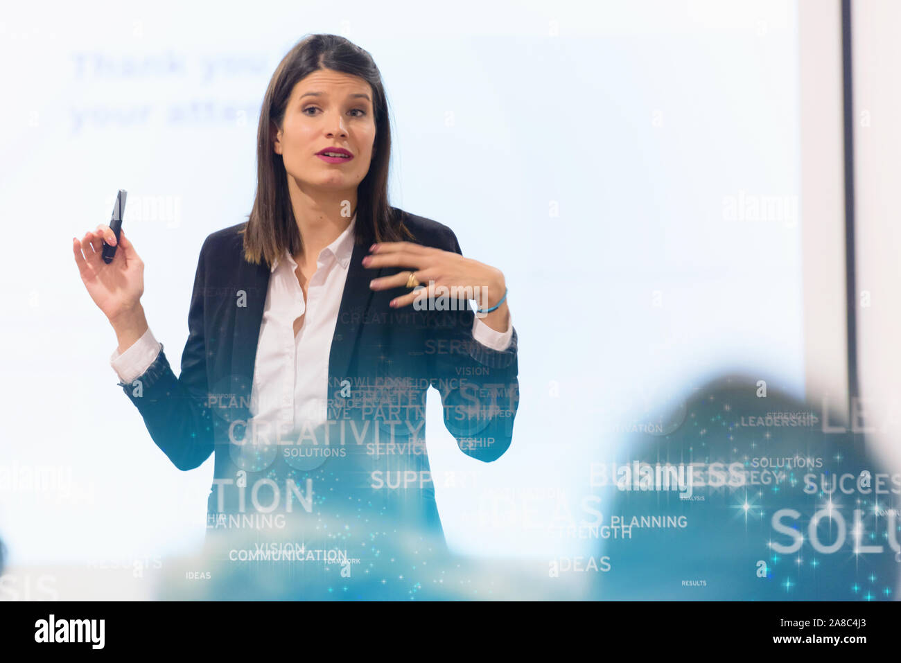 Pretty young businesswoman, teacher or mentor coach speaking to young ...