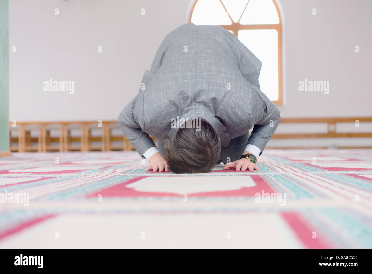 Religious muslim man praying inside the mosque Stock Photo - Alamy