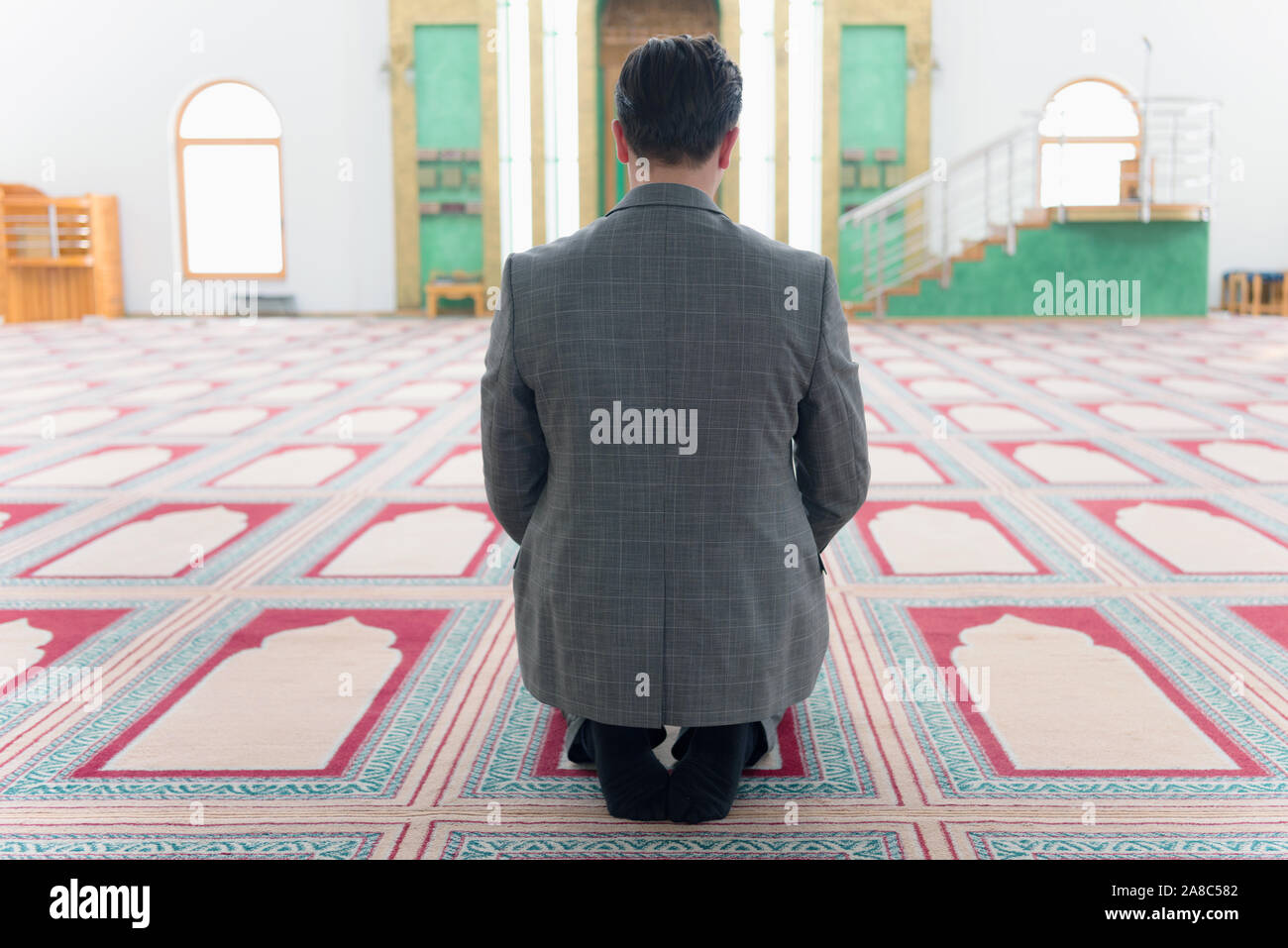 Religious muslim man praying inside the mosque Stock Photo - Alamy
