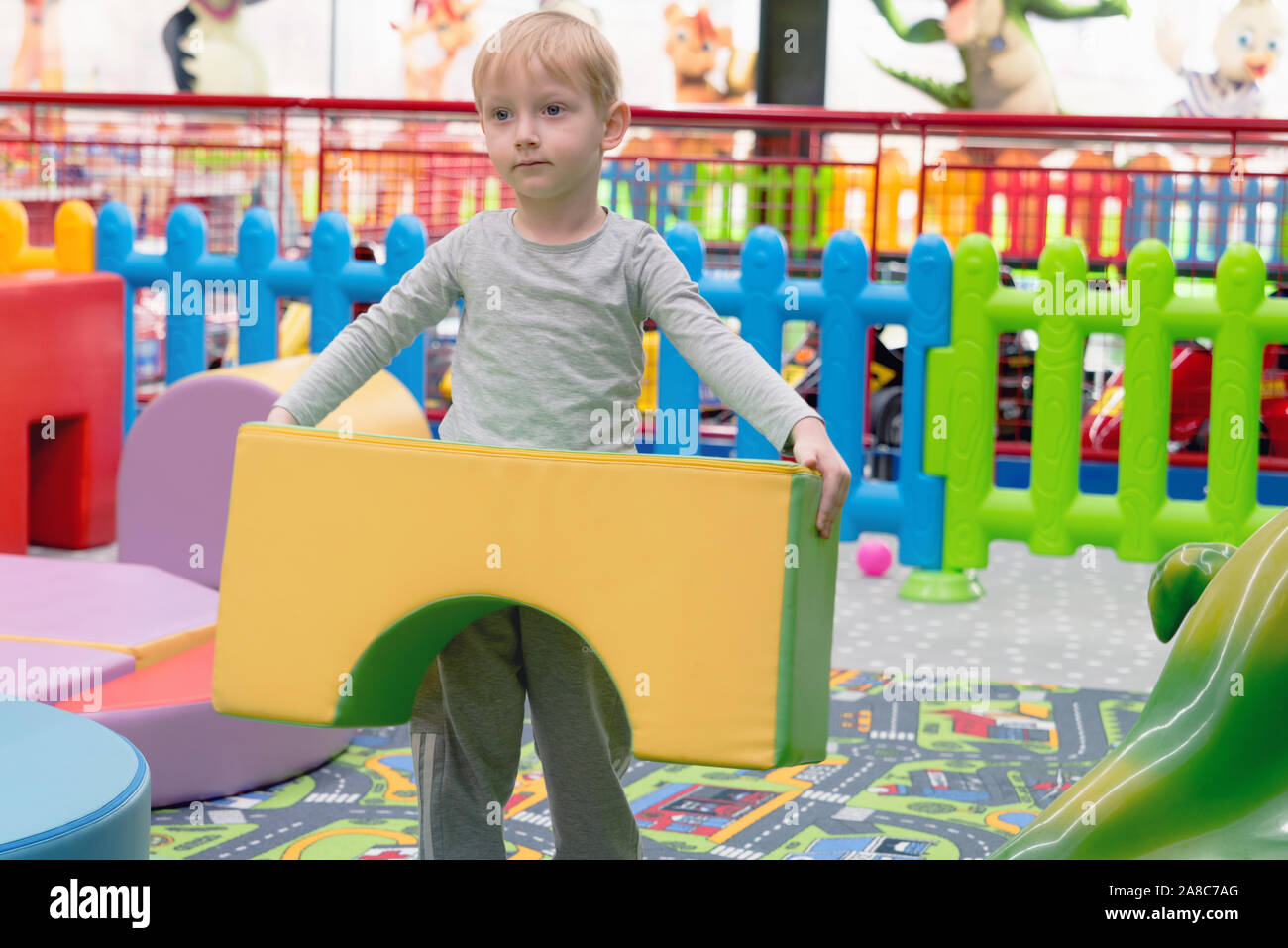 Kid playing at new playground kindergarten. Four years european boy ...