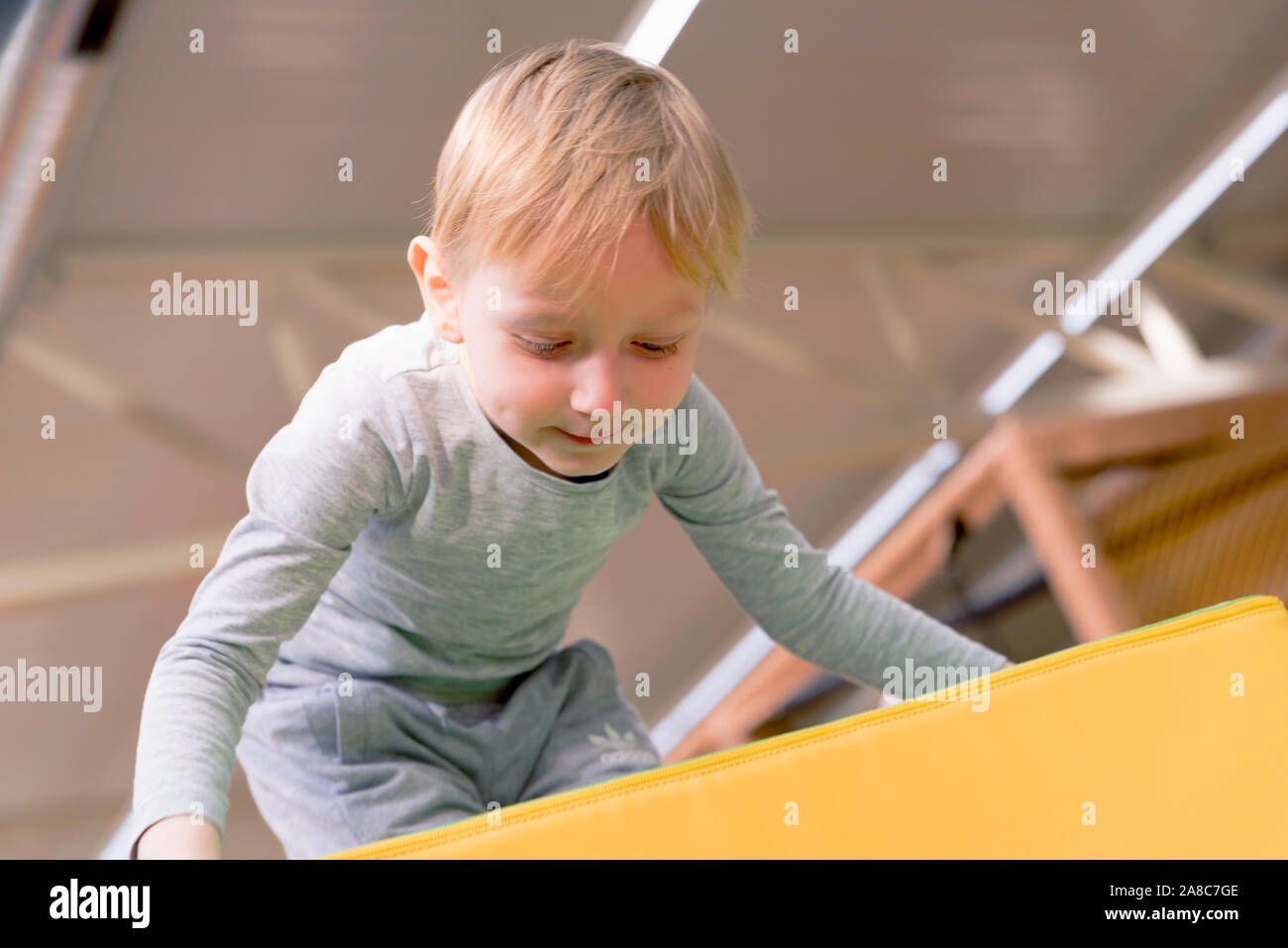 Kid playing at new playground kindergarten. Four years european boy ...