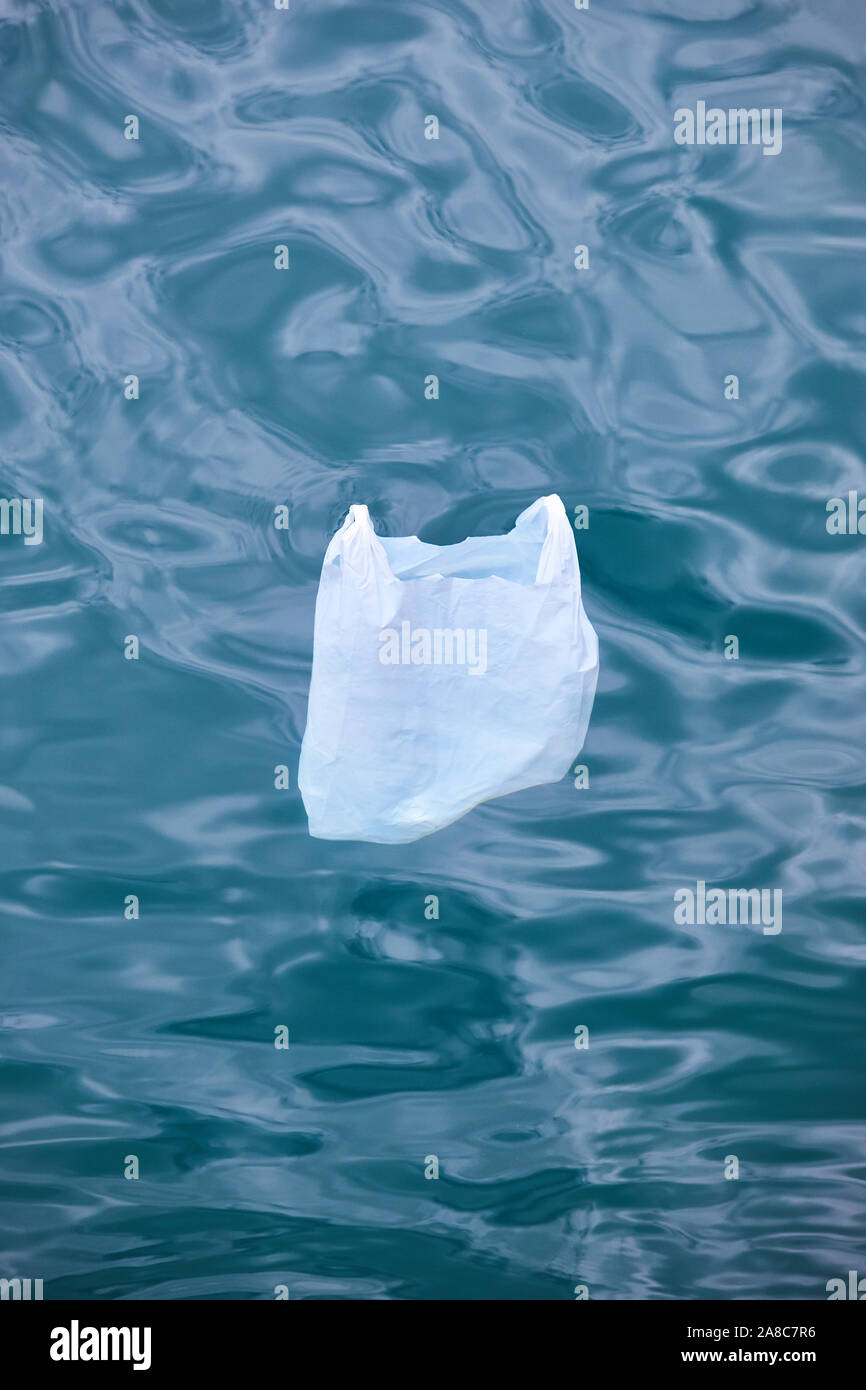 Plastic bag floating into the sea. Environmental damage pollution ...