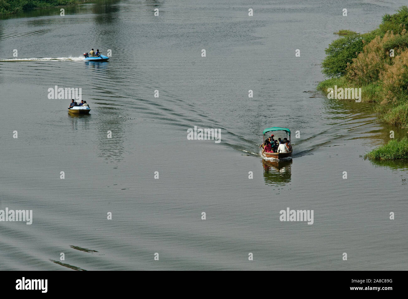 Tourist enjoying boat ride Stock Photo - Alamy