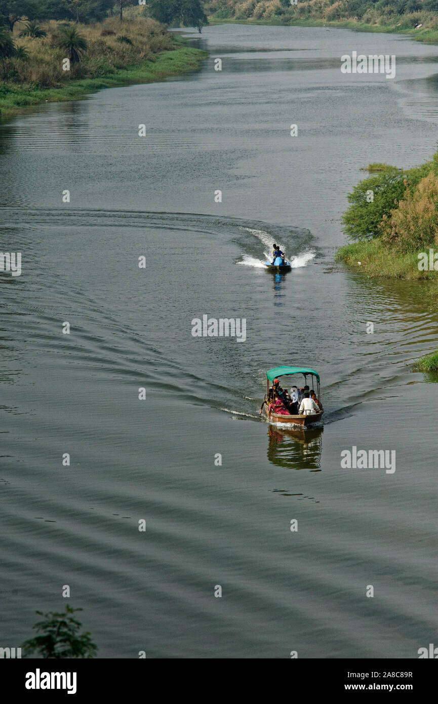 Tourist enjoying boat ride Stock Photo - Alamy