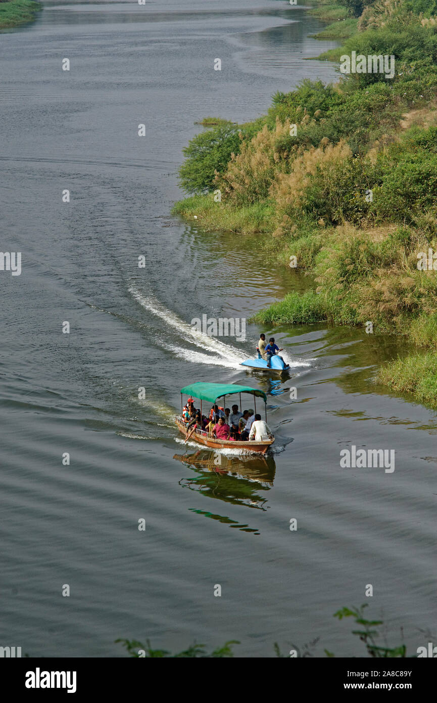 Tourist enjoying boat ride Stock Photo - Alamy