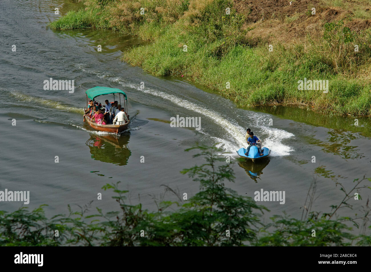 Tourist enjoying boat ride Stock Photo - Alamy