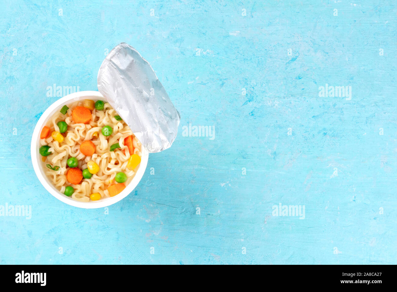 Ramen cup, instant noodles in a plastic cup, shot from the top on a ...