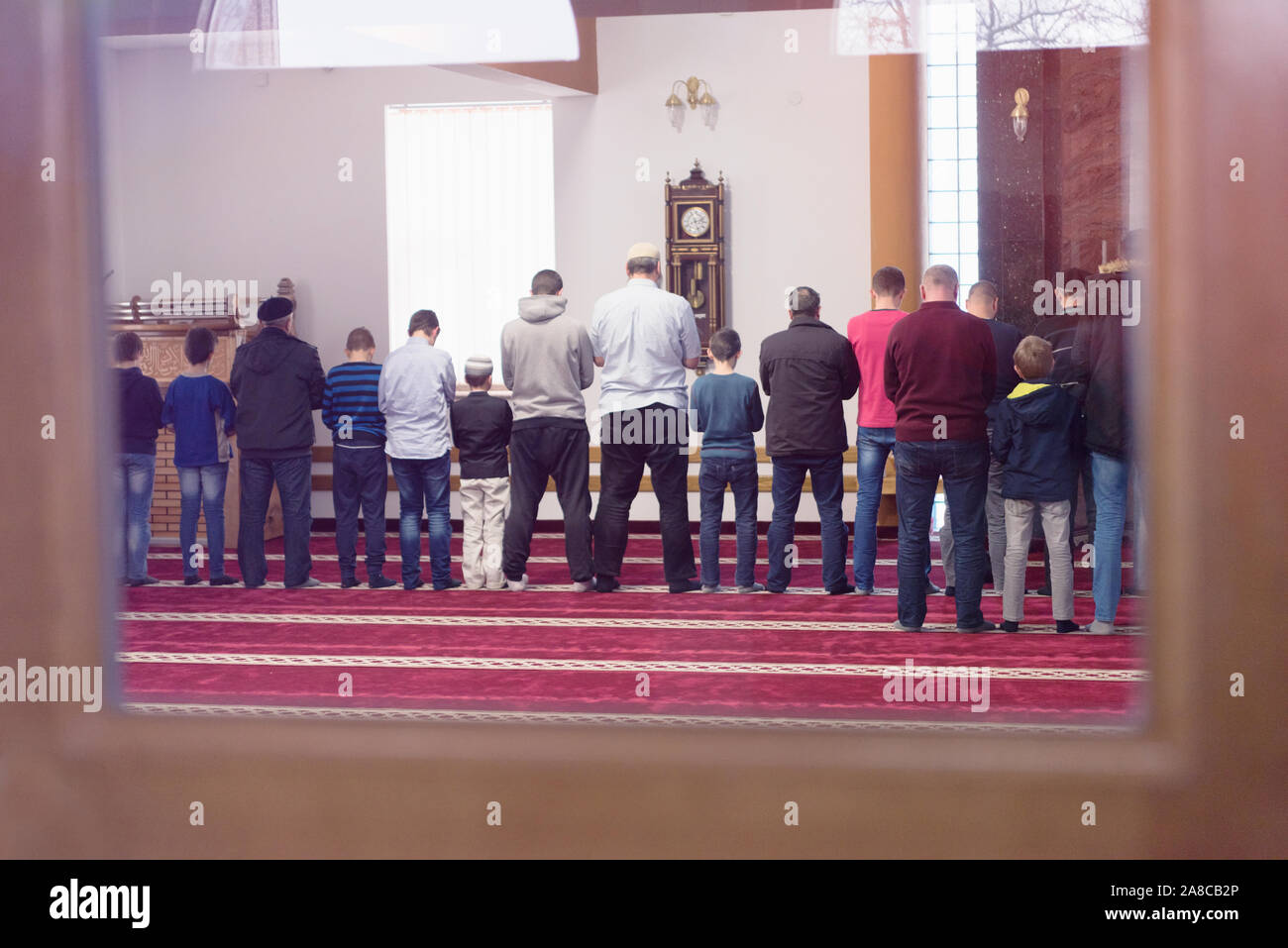 Religious muslim prayers praying together inside the big mosque Stock ...