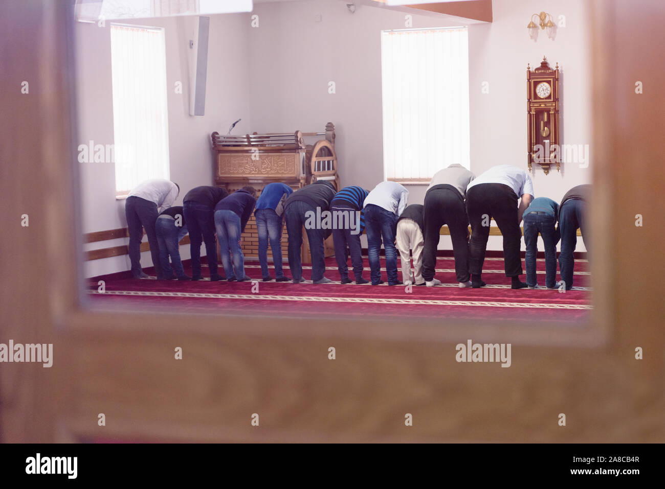 Religious muslim prayers praying together inside the big mosque Stock ...