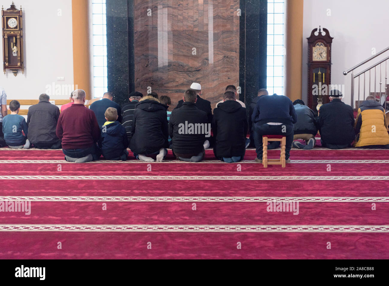 Religious muslim prayers praying together inside the big mosque Stock ...