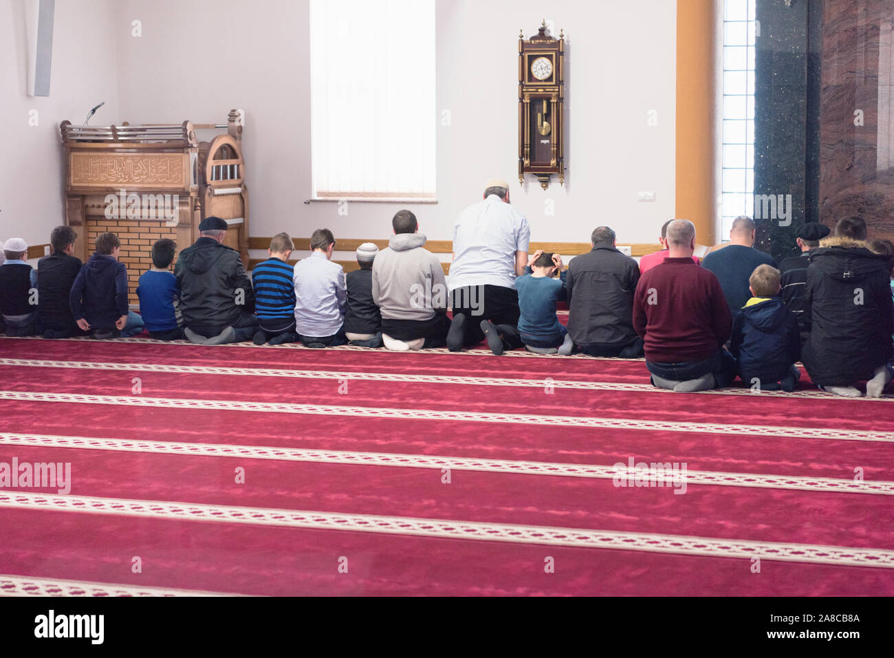 Religious muslim prayers praying together inside the big mosque Stock ...