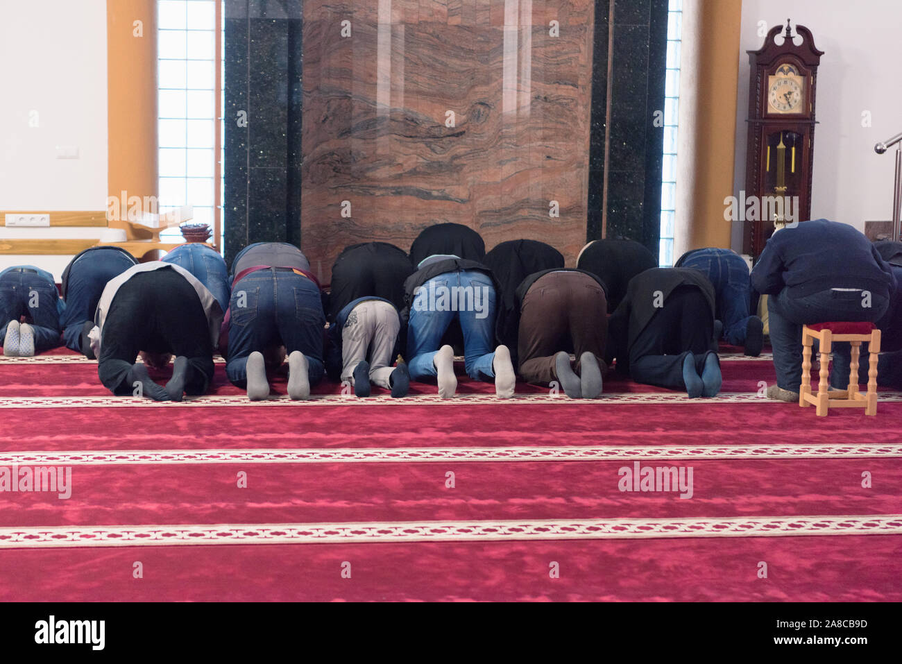 Religious muslim prayers praying together inside the big mosque Stock ...