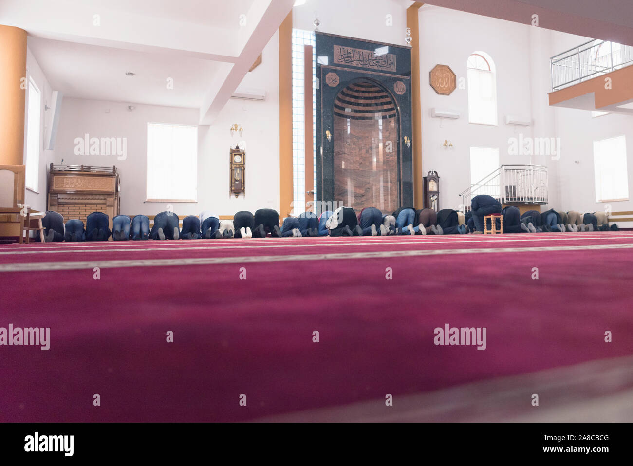 Religious muslim prayers praying together inside the big mosque Stock ...