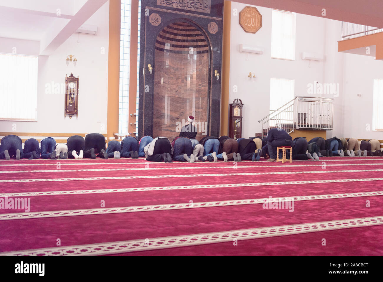 Religious muslim prayers praying together inside the big mosque Stock ...