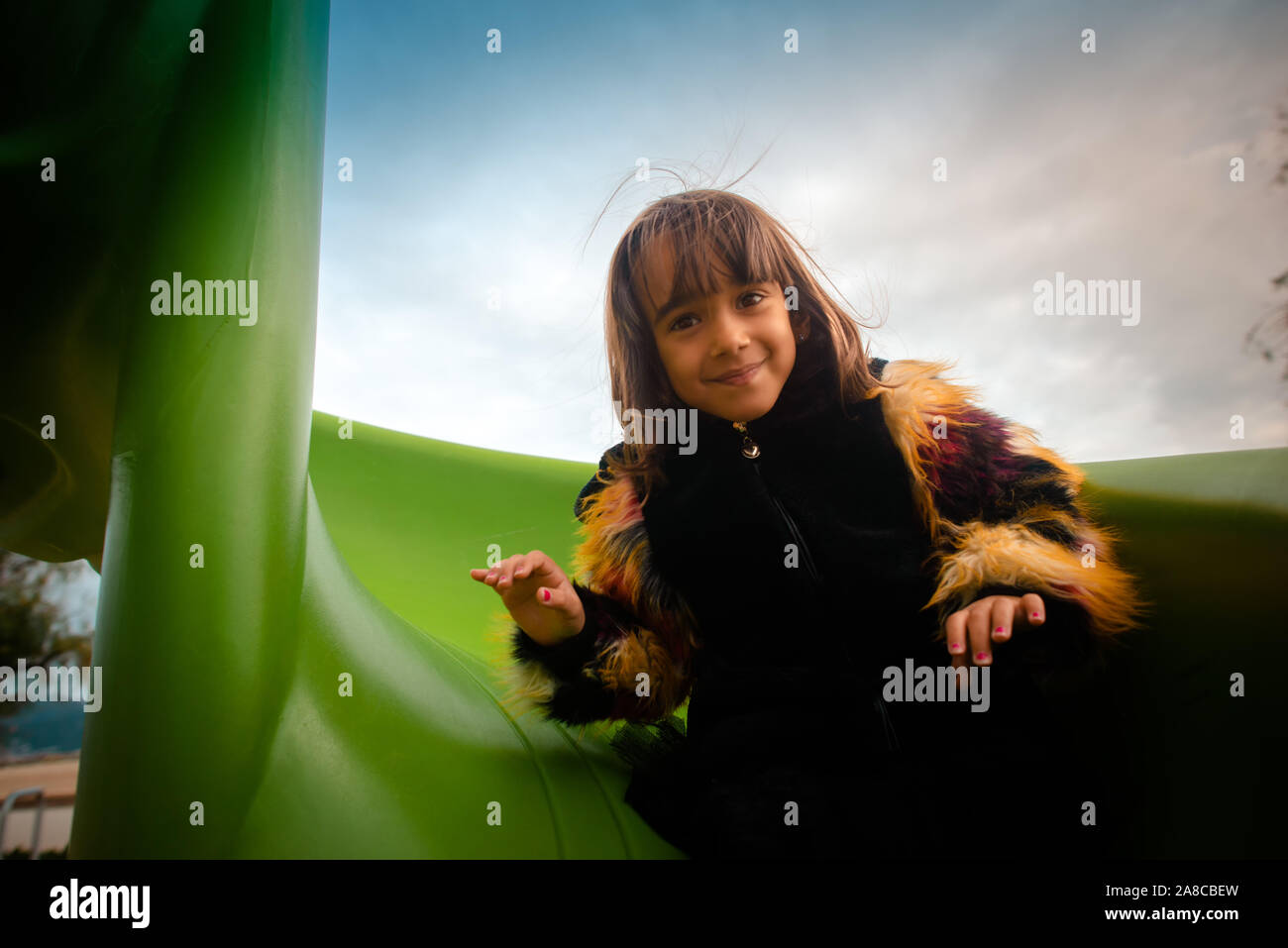 Girl sliding down the slide hi-res stock photography and images - Alamy