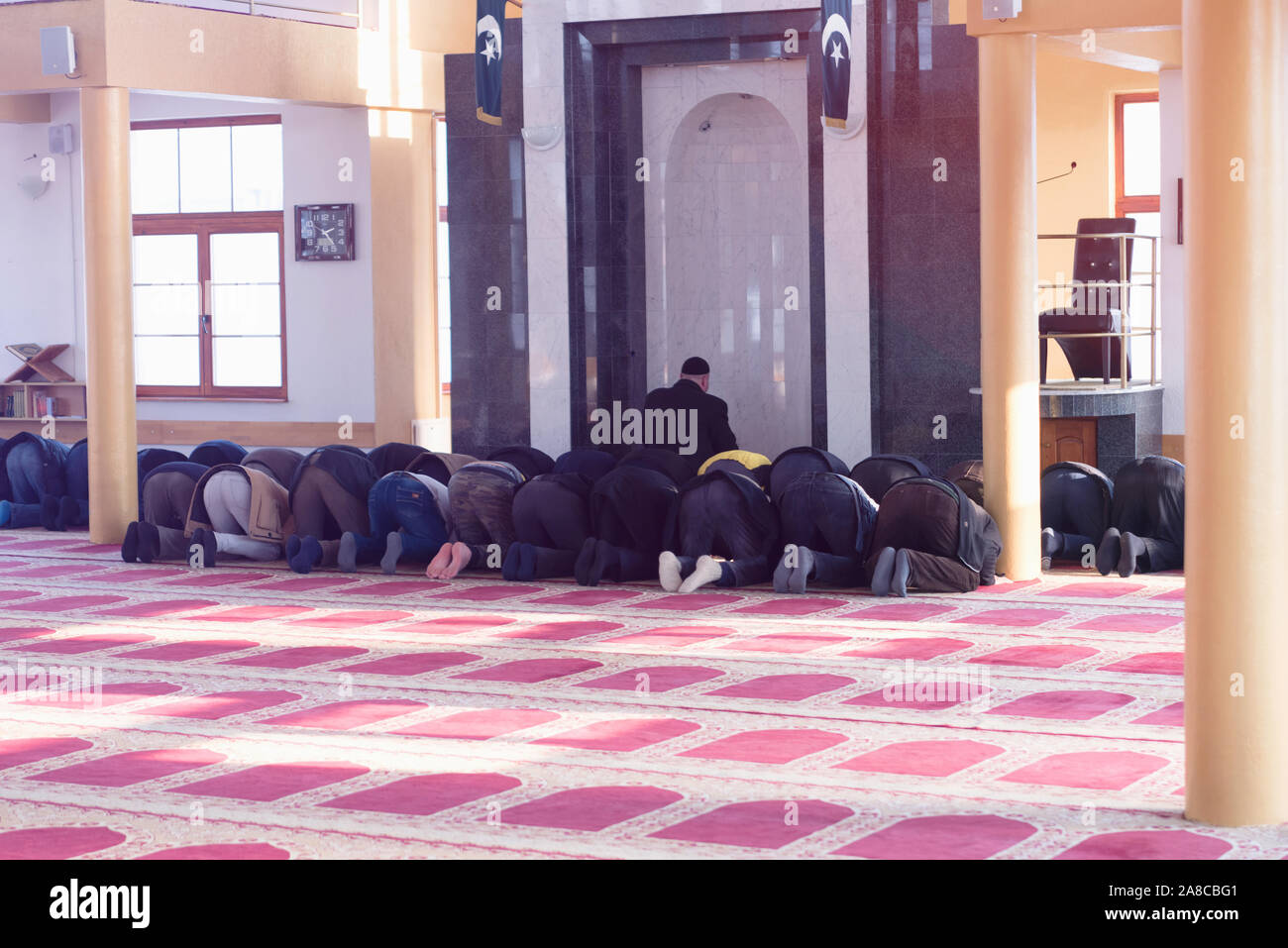 Religious muslim prayers praying together inside the big mosque Stock ...