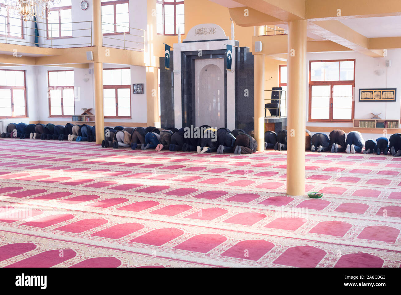 Religious muslim prayers praying together inside the big mosque Stock ...